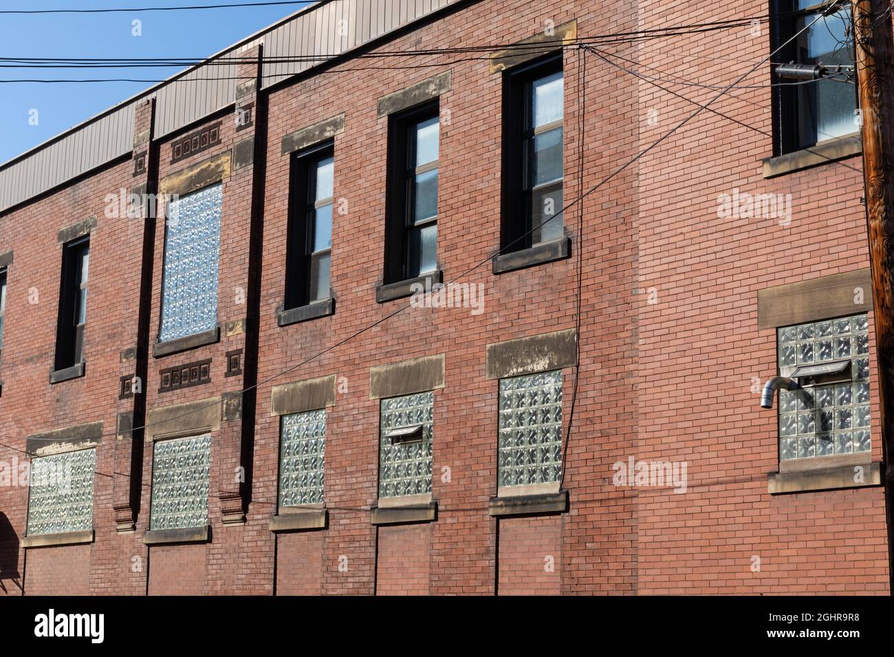 Angled view of an old red brick commercial industrial warehouse, lower ...