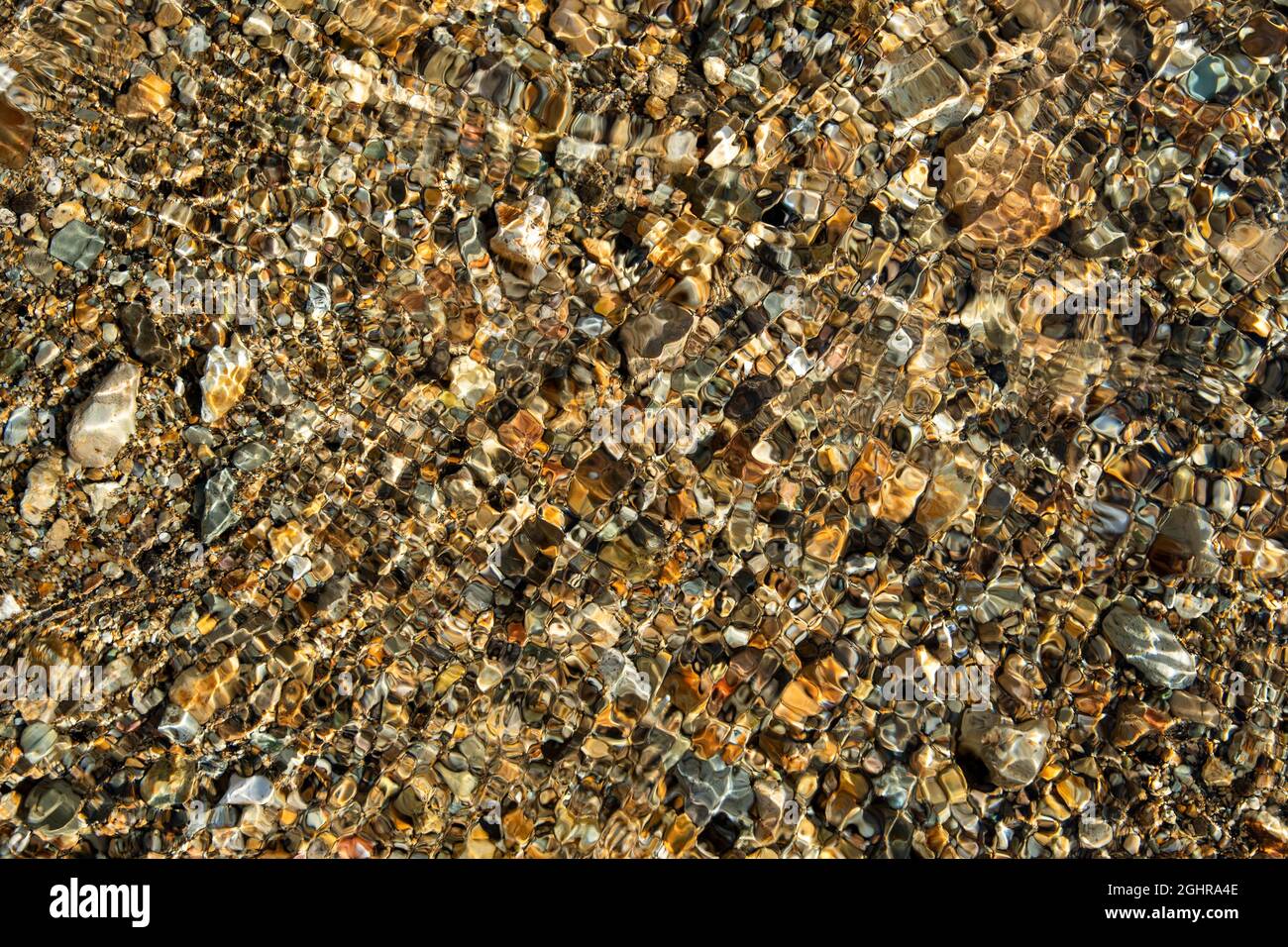 Clear water and colored rhyolite rock, river Joekulgilskvisl, Joekulgil ...