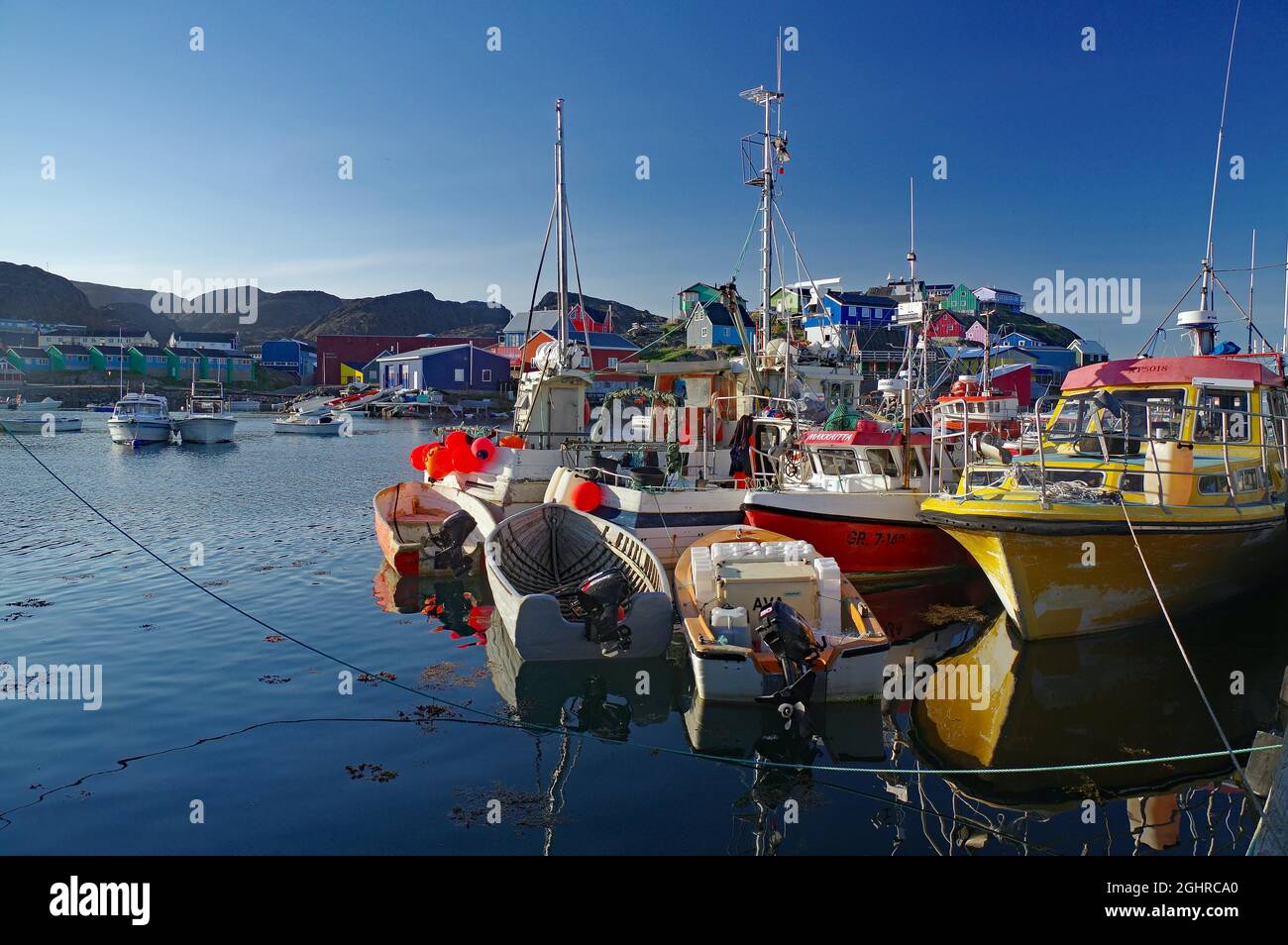 Fishing boats lying close together, Maniitsoq, Arctic, Greenland ...