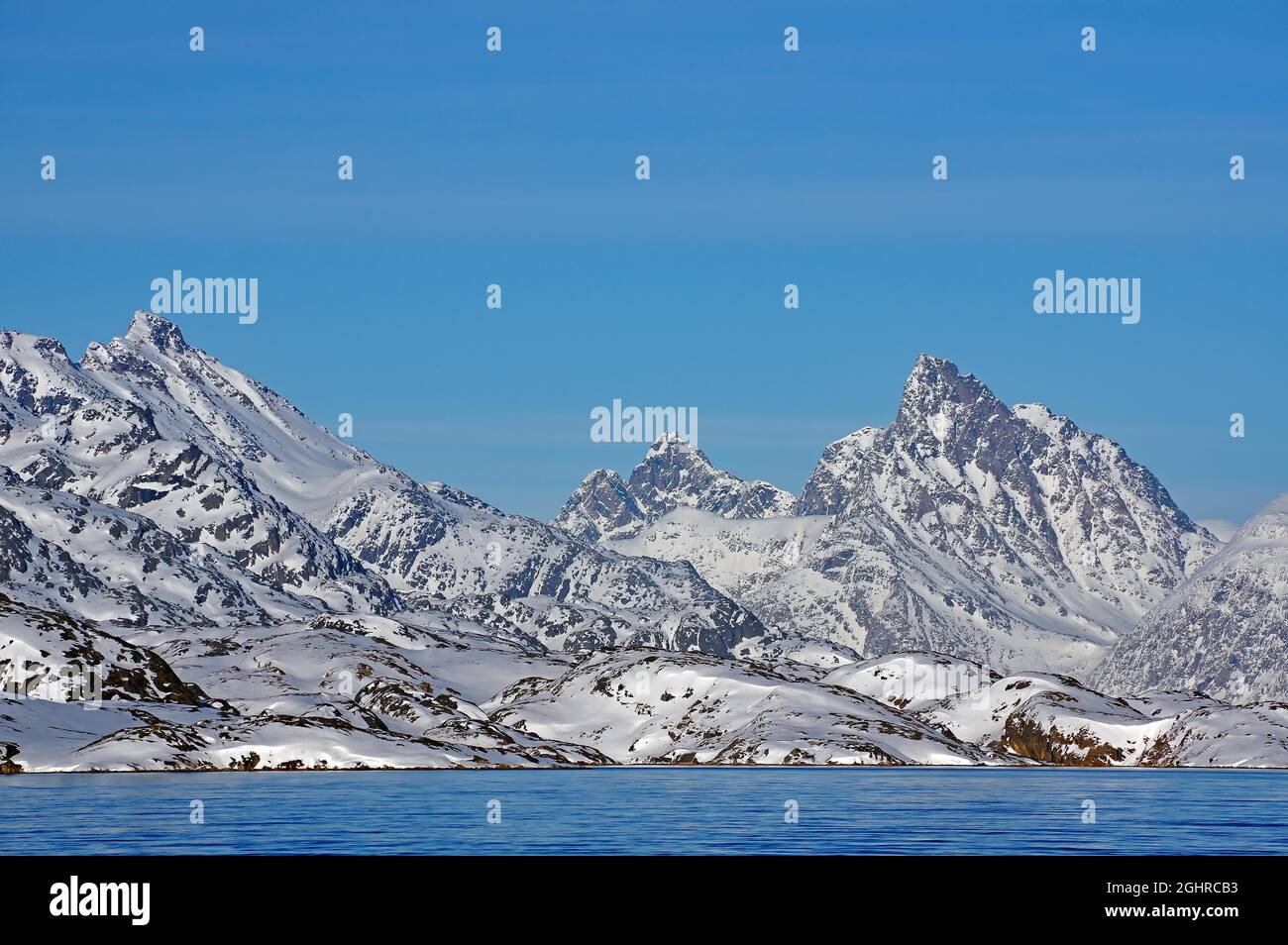 Snow-capped mountains, fjord, deserted expanse, Greenland, West ...