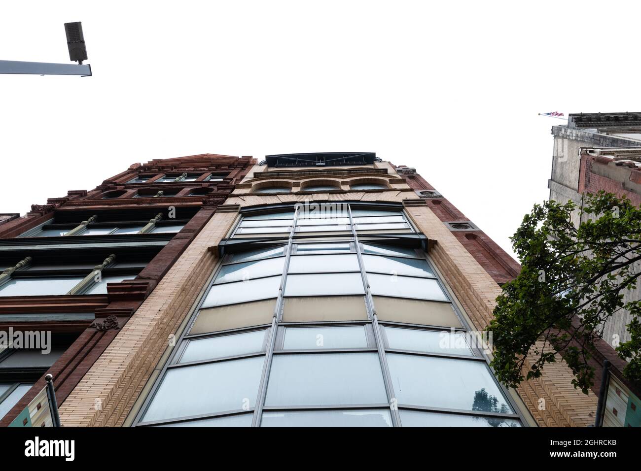 New replacement windows and details modernize an old brick commercial ...