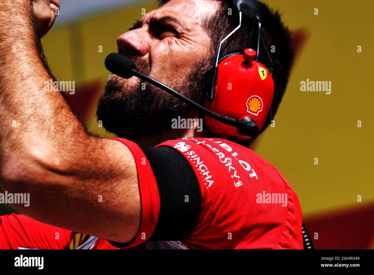 Ferrari employee wearing a black armband in tribute to the passing of ...