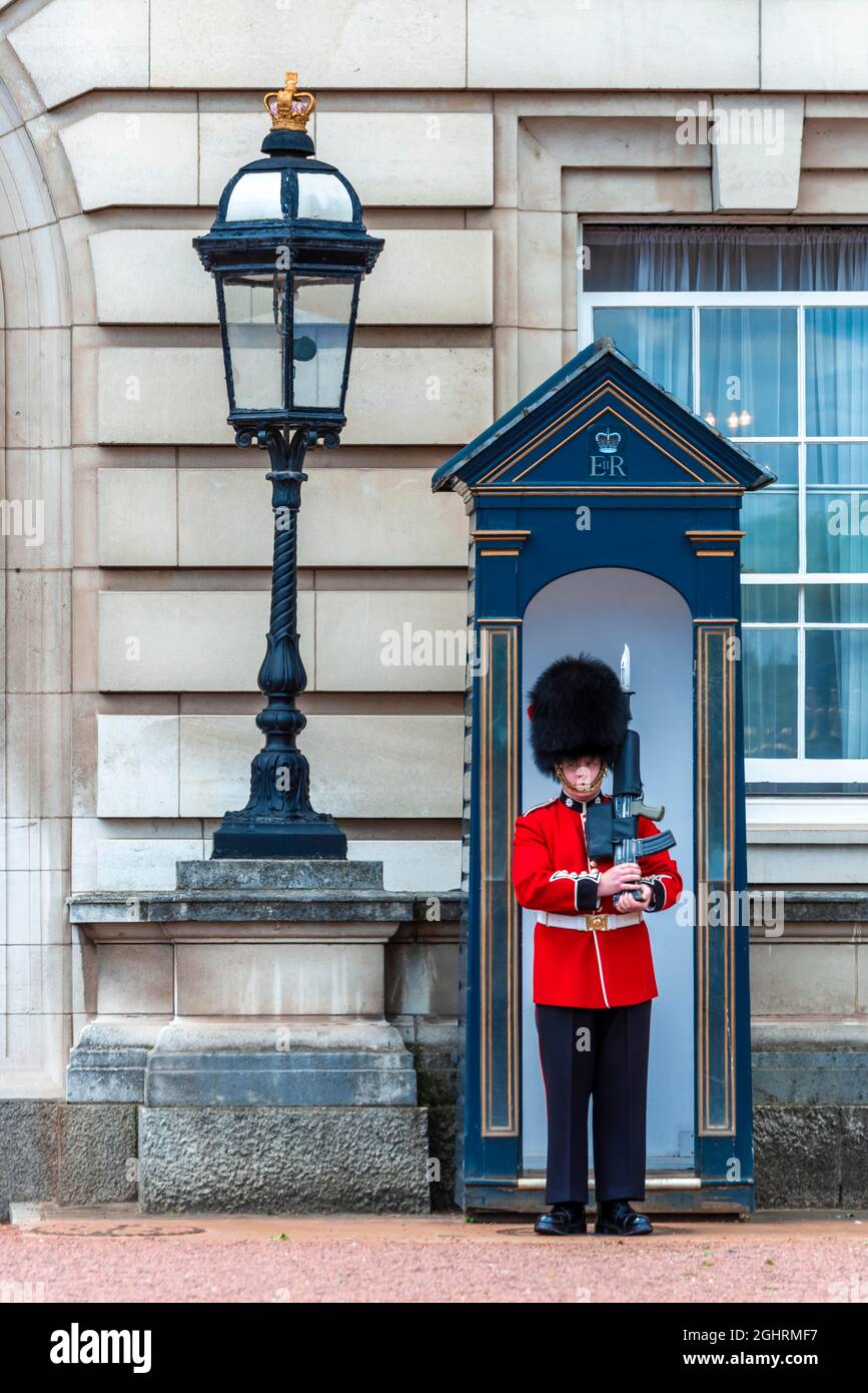 Guard in front of guard house, guard of the royal guard with bearskin ...