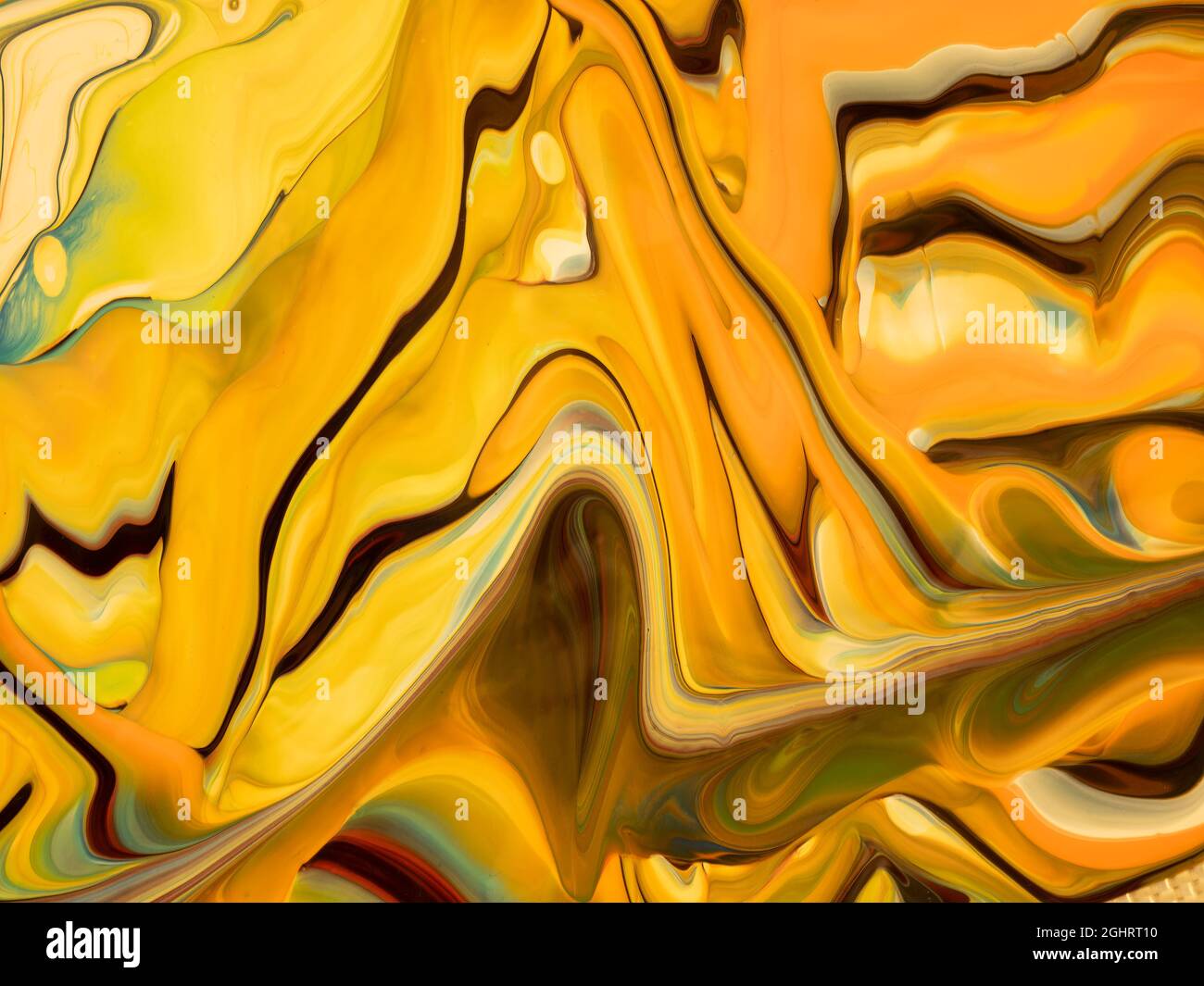 Abstract image of various colors of acrylic paint mixed together using ...
