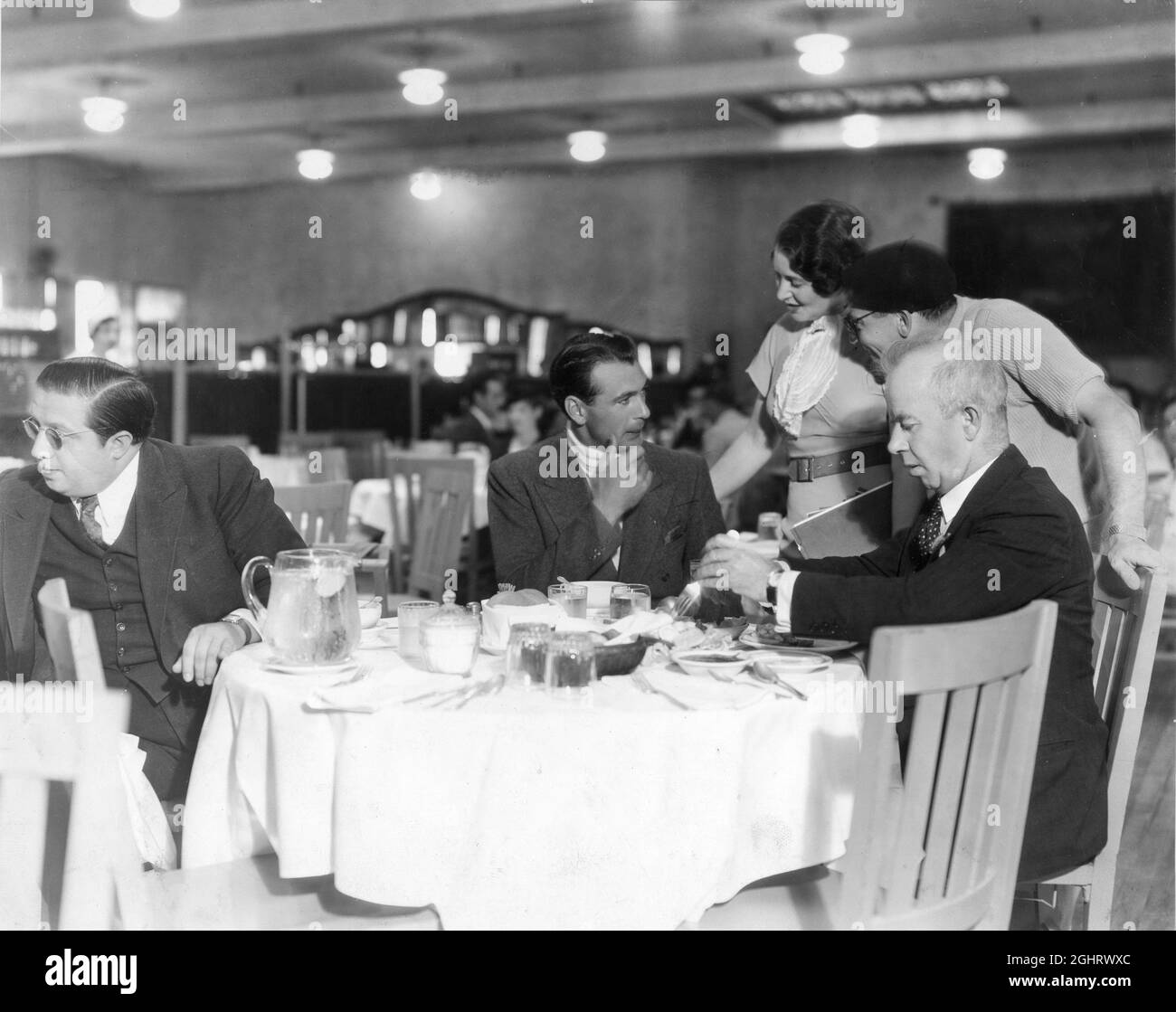 CHICO MARX and his Wife BETTY greet GARY COOPER lunching at the ...
