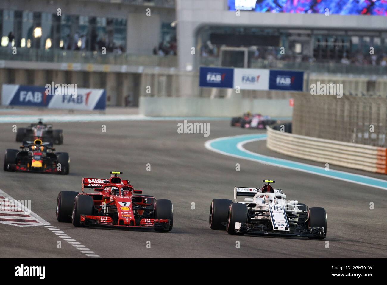 (L to R): Kimi Raikkonen (FIN) Ferrari SF71H and Charles Leclerc (MON ...