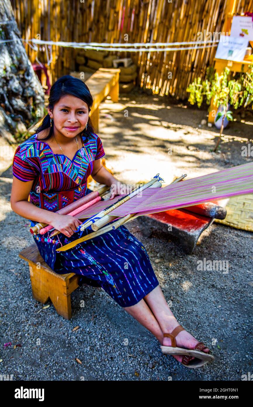 Weaver with haft loom, demonstration of traditional Mayan weaving, Ajto ...