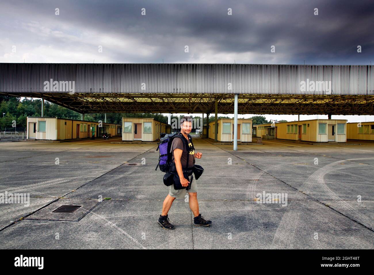 Check-in barracks for cars, hikers, man with backpack, former border ...