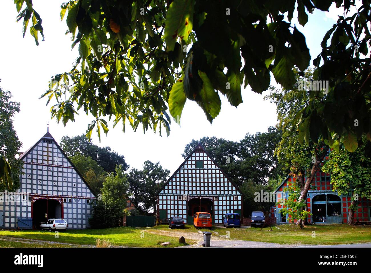 Half-timbered buildings, courtyards of a Rundling village in the ...