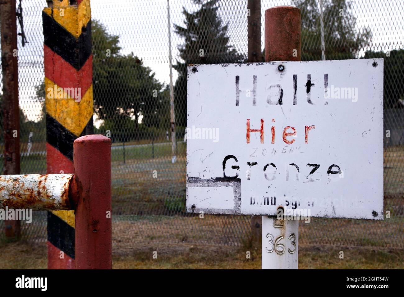 Sign Halt! Here border post post post post post, barrier fence, barbed ...