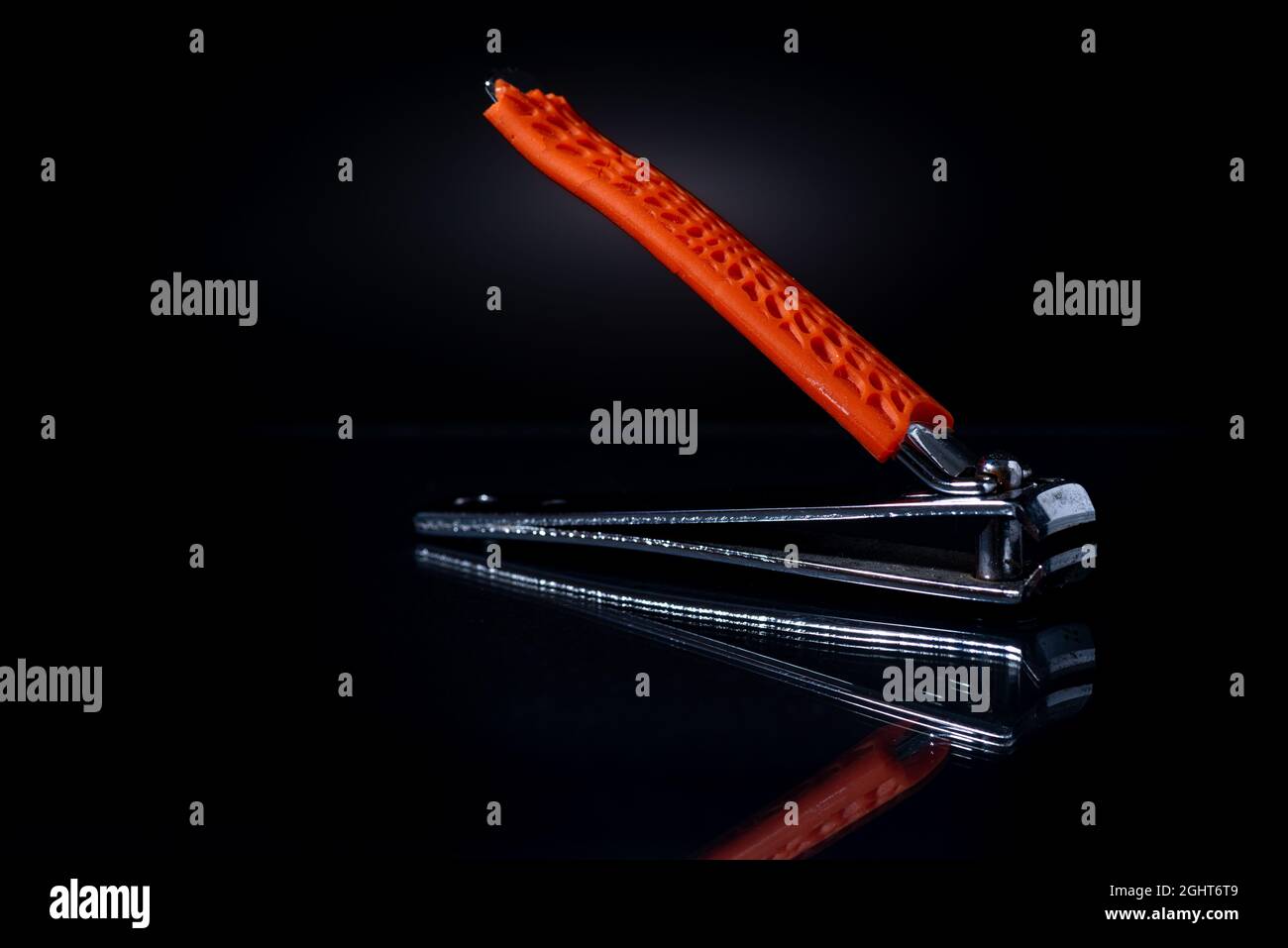 old nail clippers on a black background health care and beauty ...