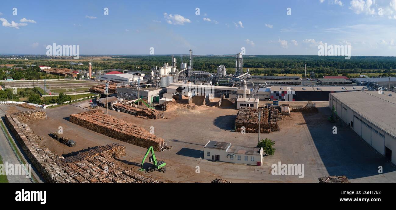 Aerial view of wood processing factory with stacks of lumber at plant ...