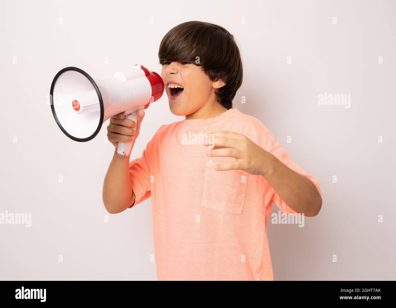 Portrait Of Young boy Shouting With A Megaphone Isolated On White ...