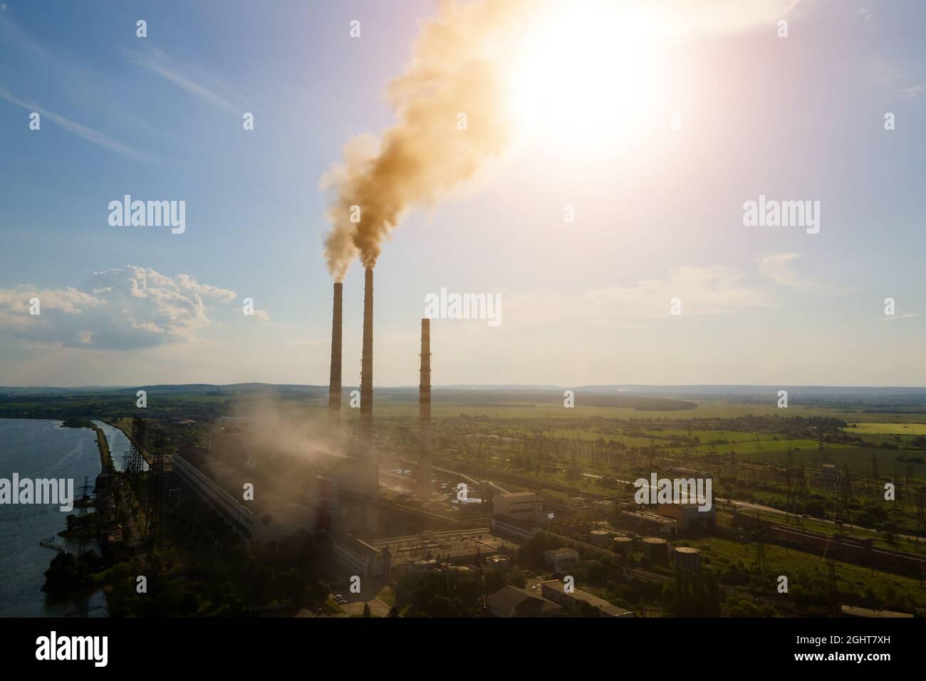 Aerial view of coal power plant high pipes with black smokestack ...