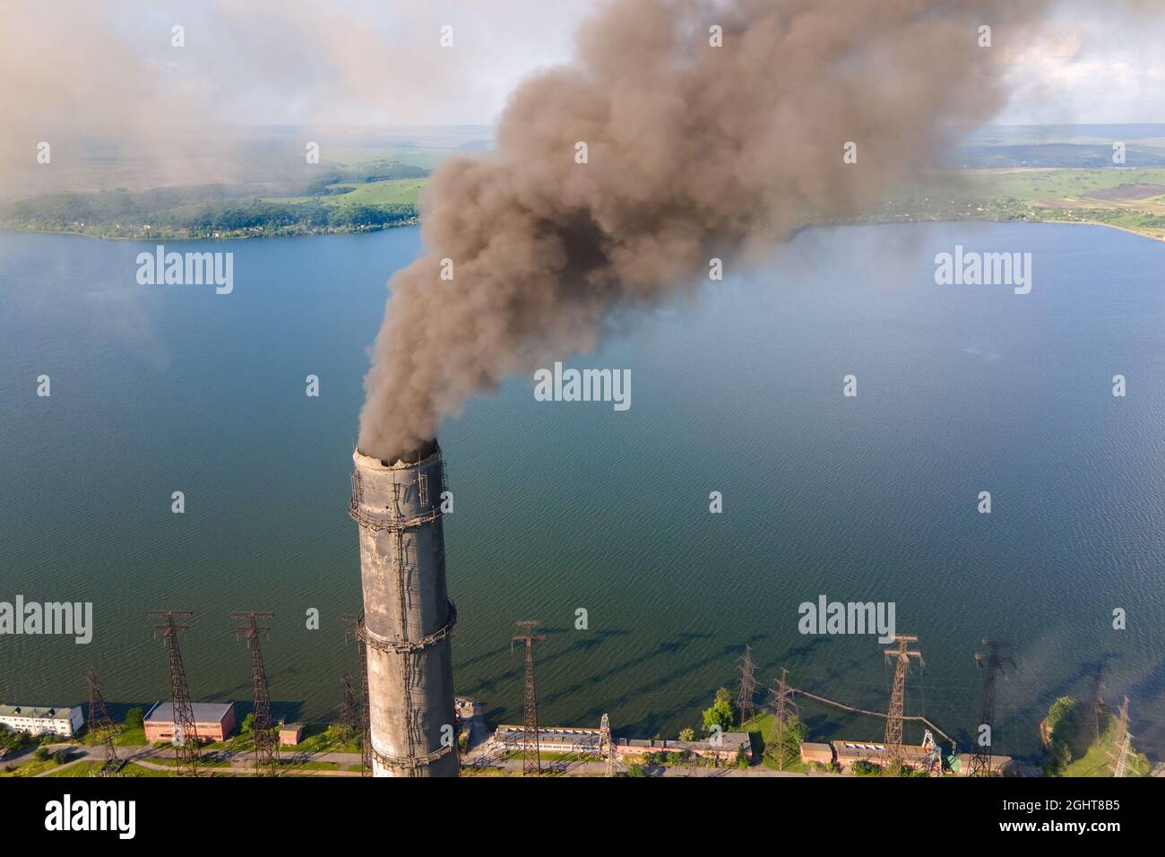 Aerial view of coal power plant high pipes with black smokestack ...