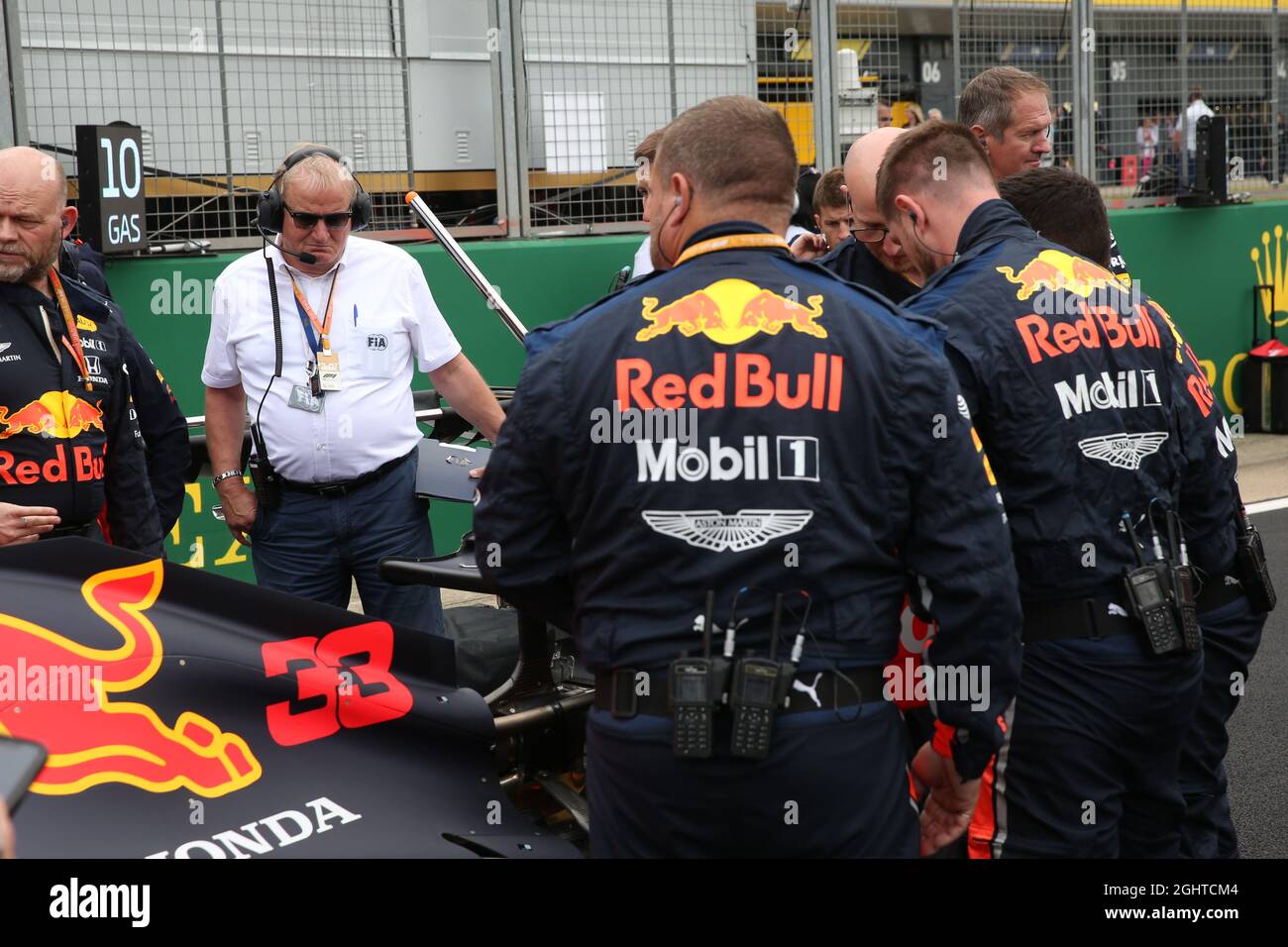 Jo Bauer (GER) FIA Delegate looks at repairs being made to the Red Bull ...