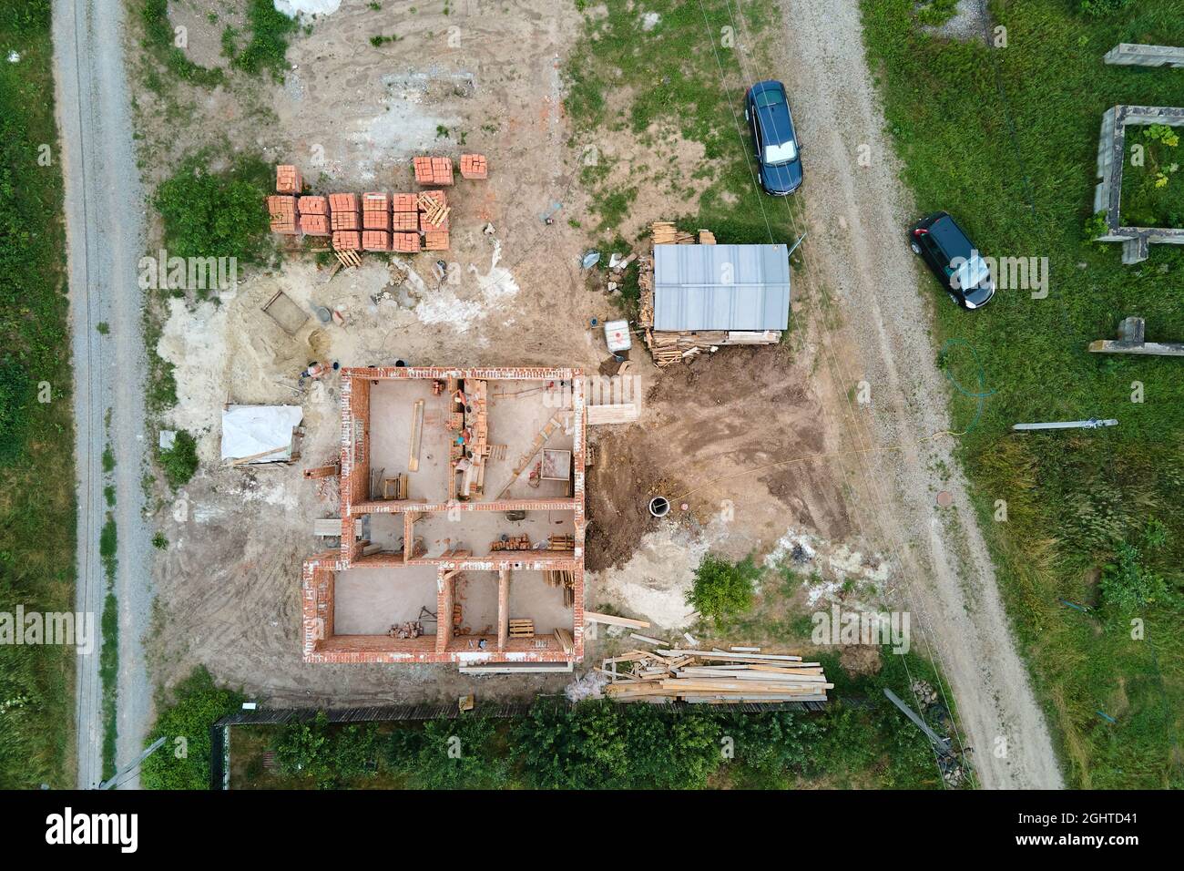 Top down aerial view of building works of new house concrete foundation ...