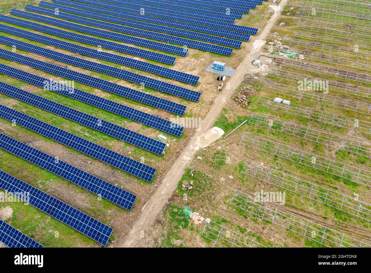 Aerial view of big electric power plant construction with many rows of ...
