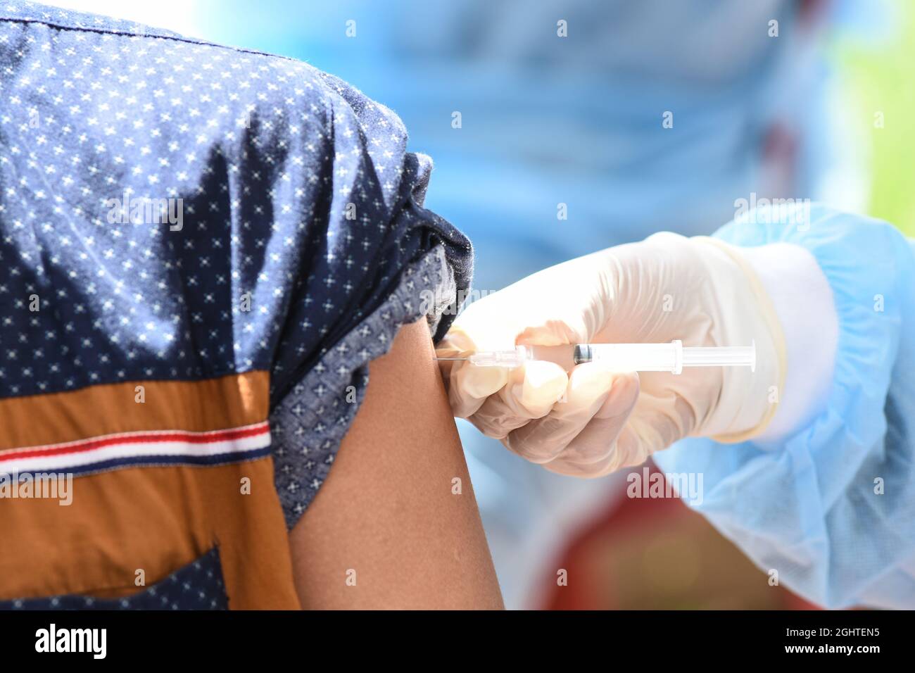 An Islamic boarding school student receives an injection of the Covid ...
