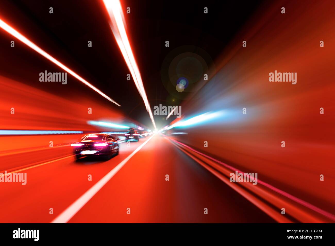Cars rush through the tunnel in the beams of searchlights Stock Photo ...