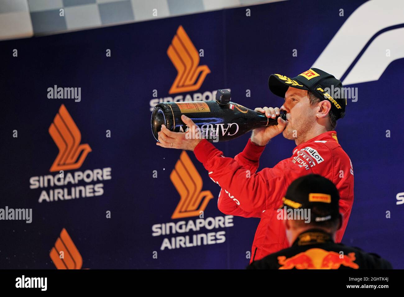 Race winner Sebastian Vettel (GER) Ferrari celebrates on the podium. 22 ...