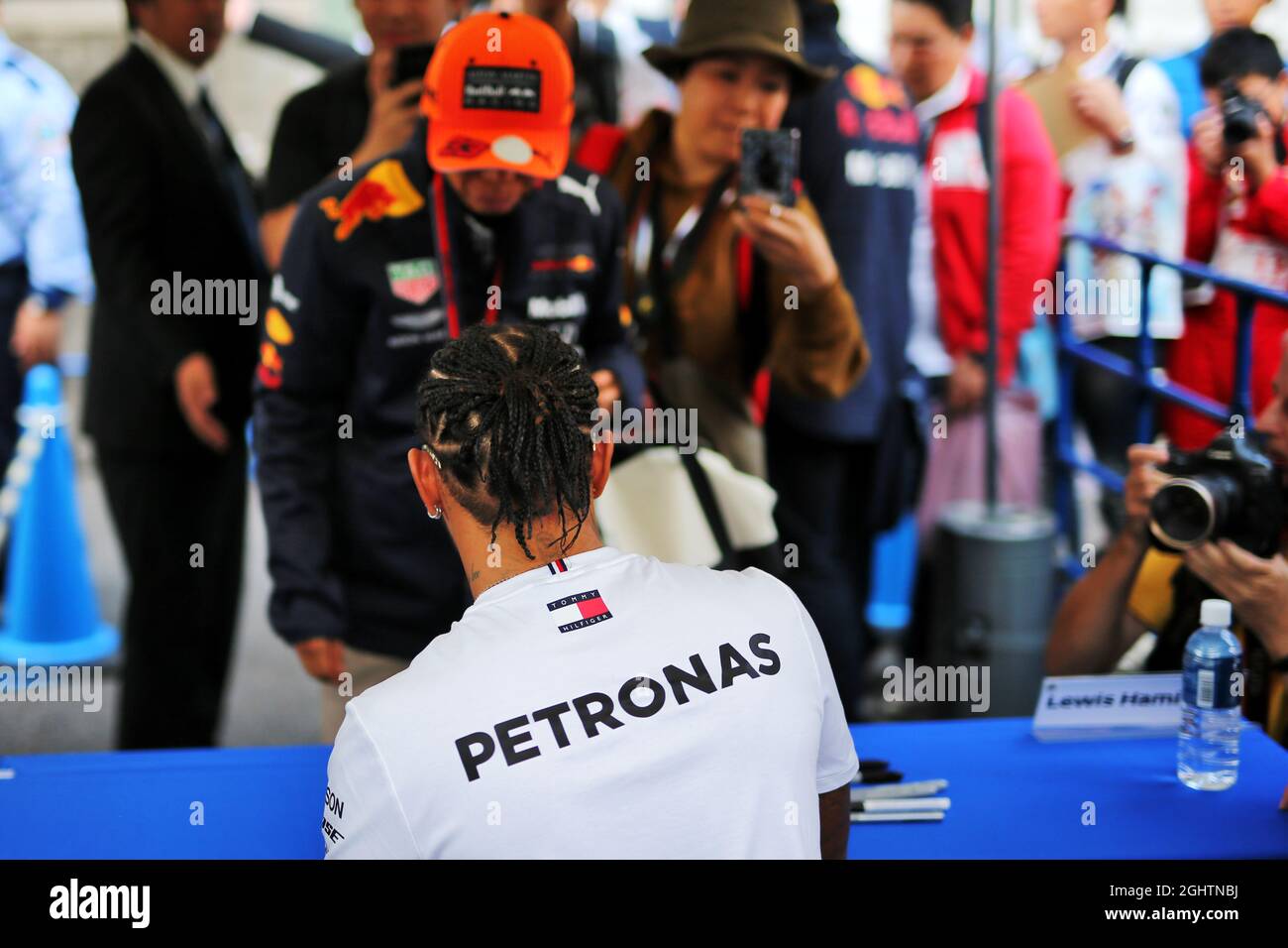 Lewis Hamilton (GBR) Mercedes AMG F1 signs autographs for the fans. 10. ...