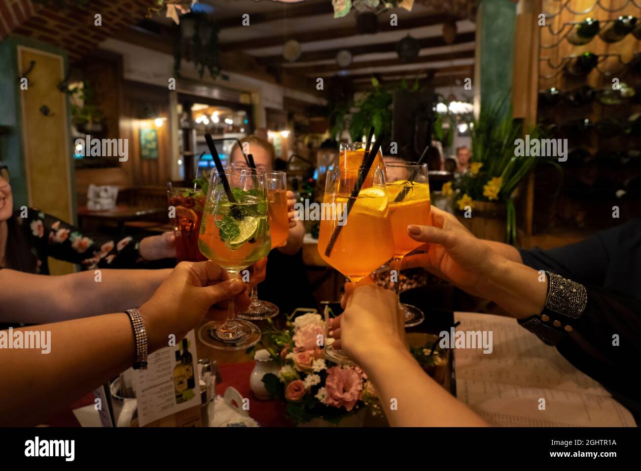 toast cheers with cocktails in a restaurant with friends Stock Photo ...