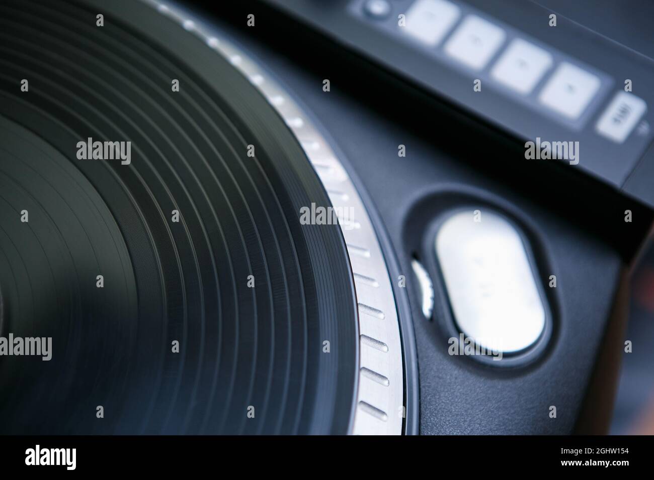 Vinyl record with music on turntable player device. Listen to the ...