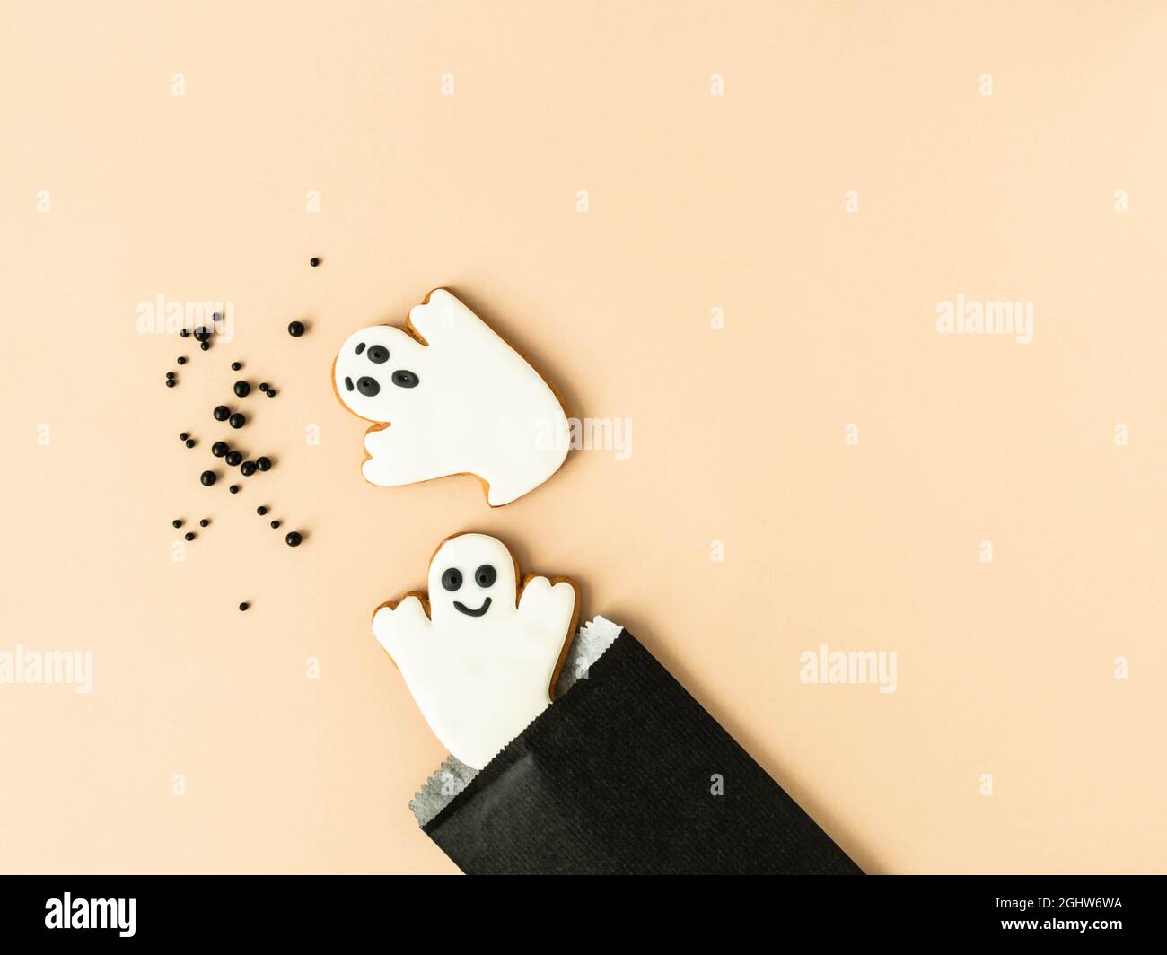 Minimal Halloween composition with gingerbread cookies ghosts and black ...