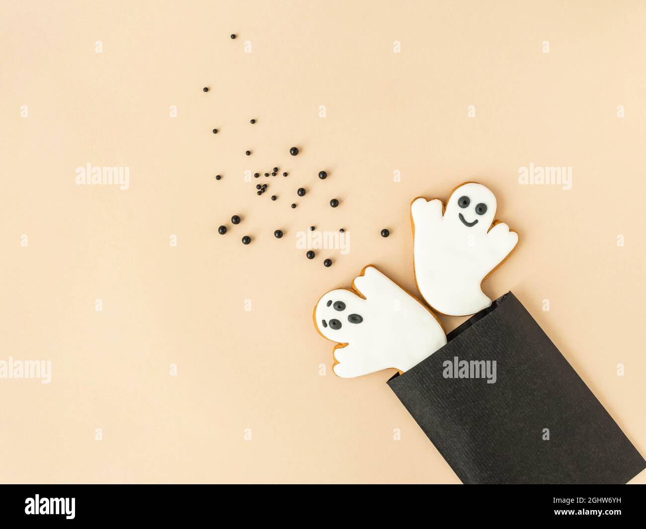 Minimal Halloween composition with gingerbread cookies ghosts and black ...