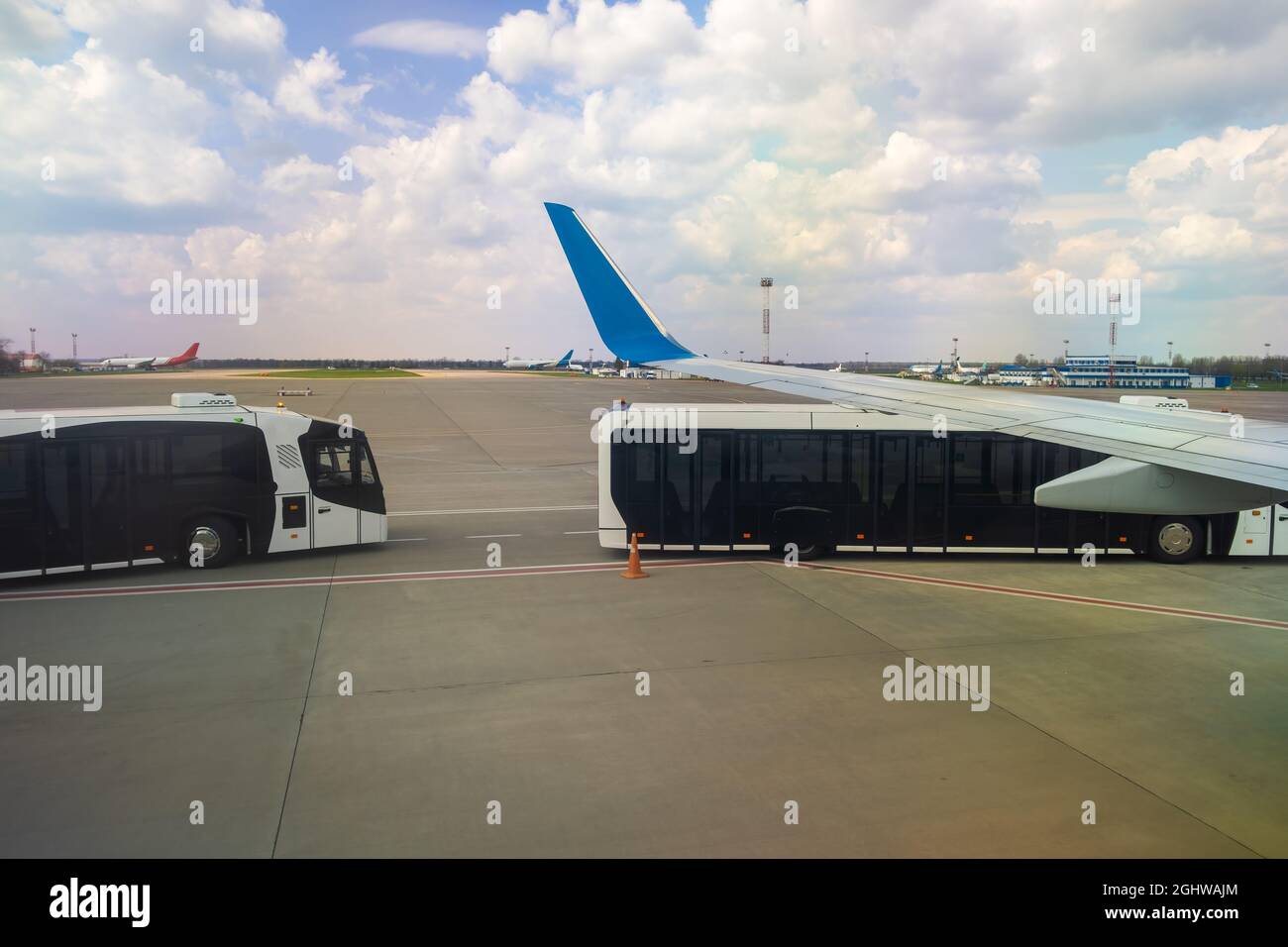 Airplane wing and special bus for moving passengers from aircraft to ...