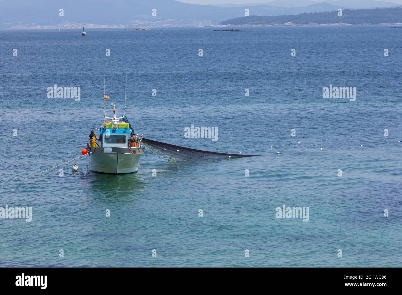Fish inside commercial fishing net hi-res stock photography and images ...