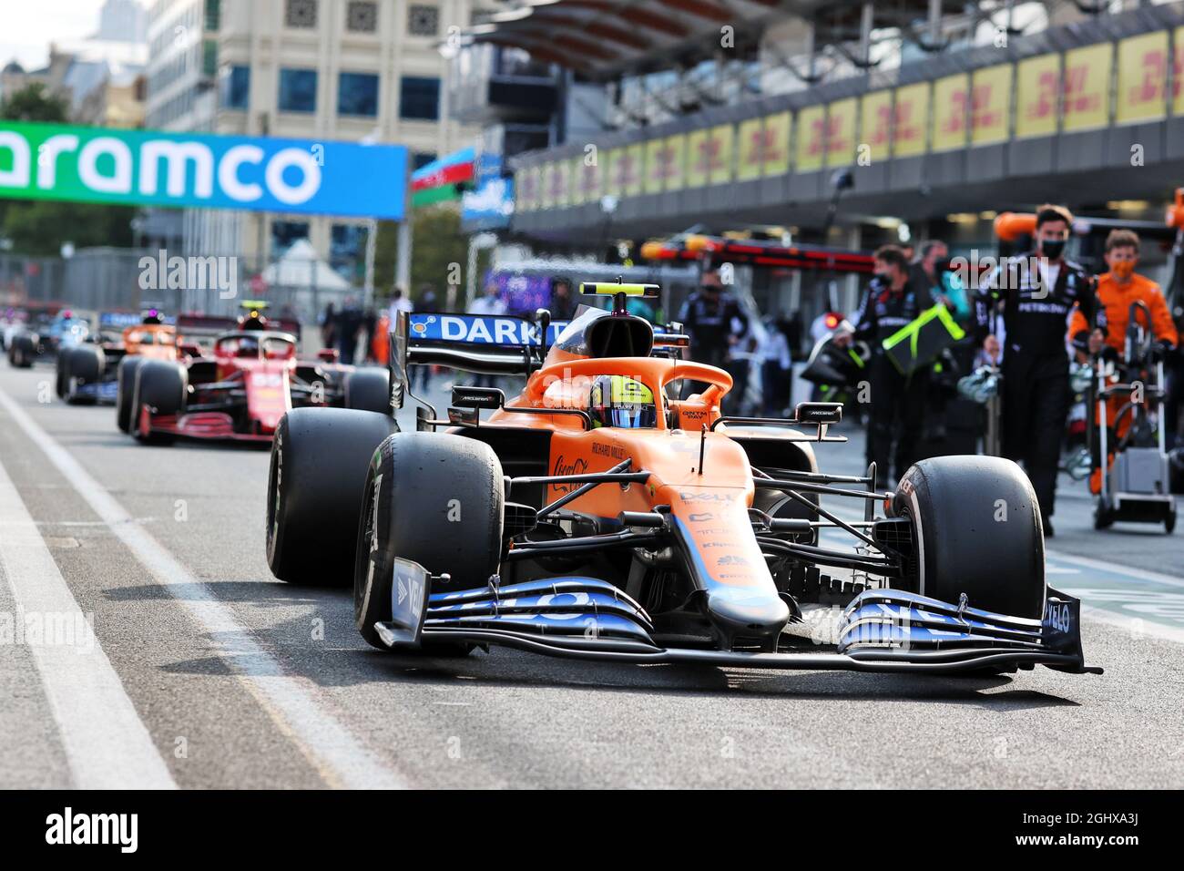 Lando Norris (GBR) McLaren MCL35M in the pits while the race is stopped ...