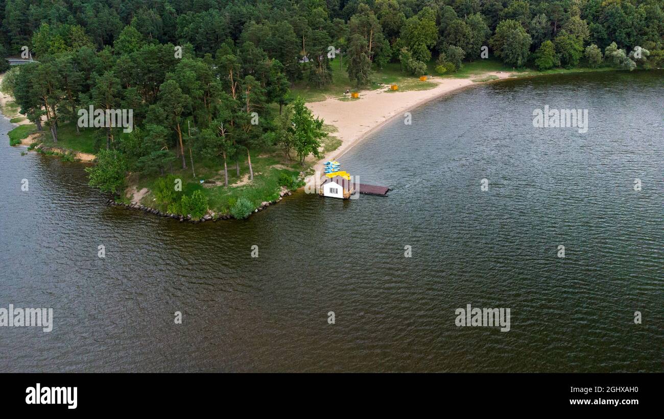 View of an island with dense forest and small residential buildings ...