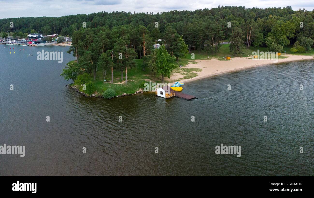 View of an island with dense forest and small residential buildings ...