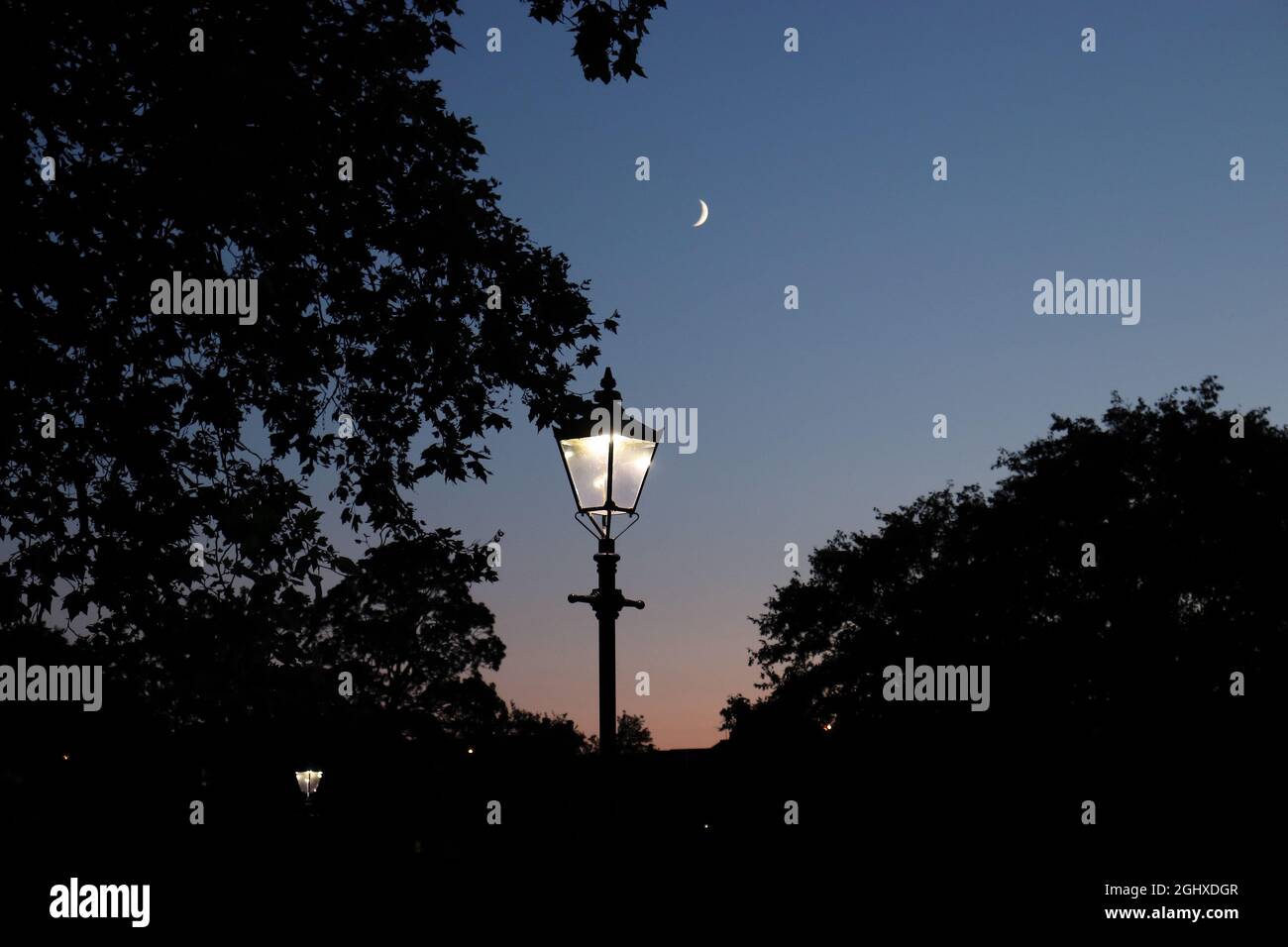 Streetlights and Moon Stock Photo - Alamy