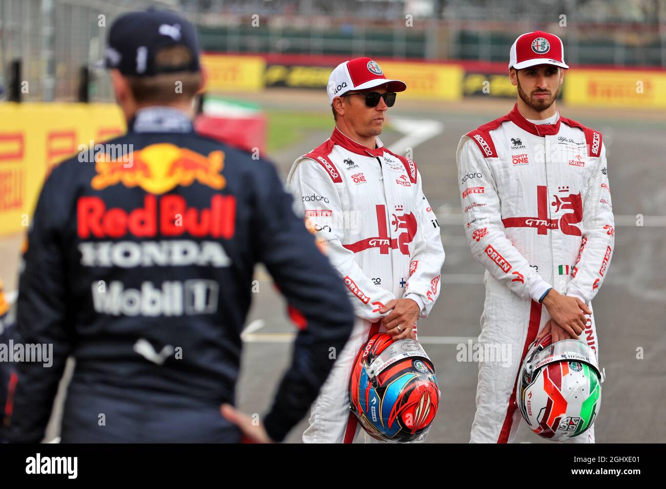 (L to R): Kimi Raikkonen (FIN) Alfa Romeo Racing and Antonio Giovinazzi ...