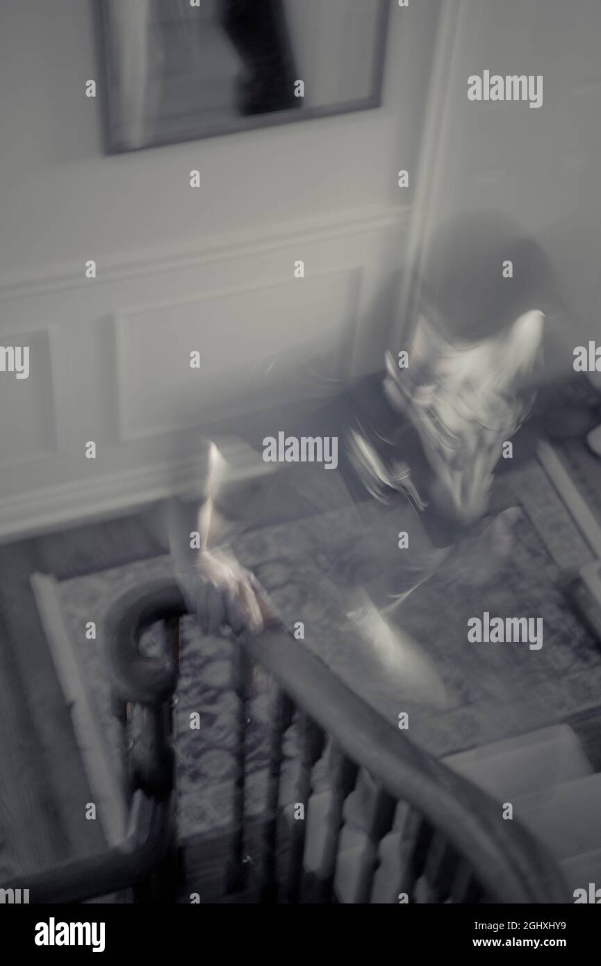 Person going up the stairs in a traditional house Stock Photo - Alamy