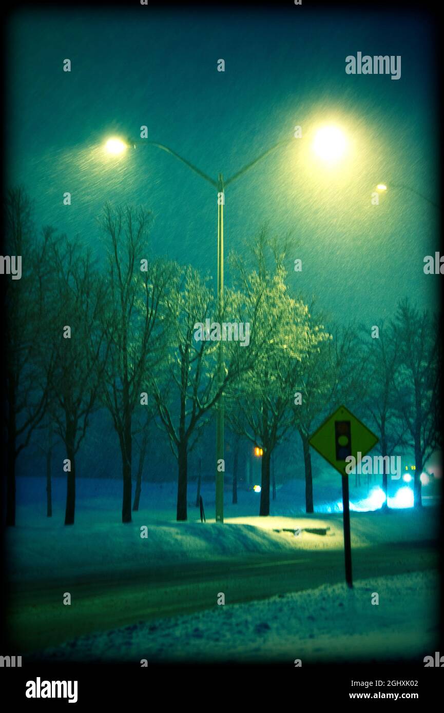 Snow falling on a deserted street at night in Toronto suburbs Stock ...