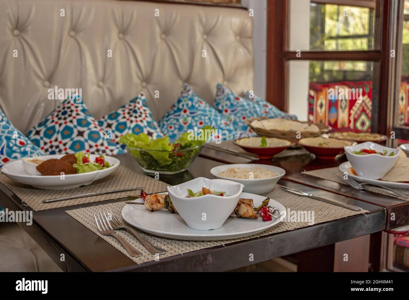 Elegant dining set up in a restaurant served with delicious dishes ...