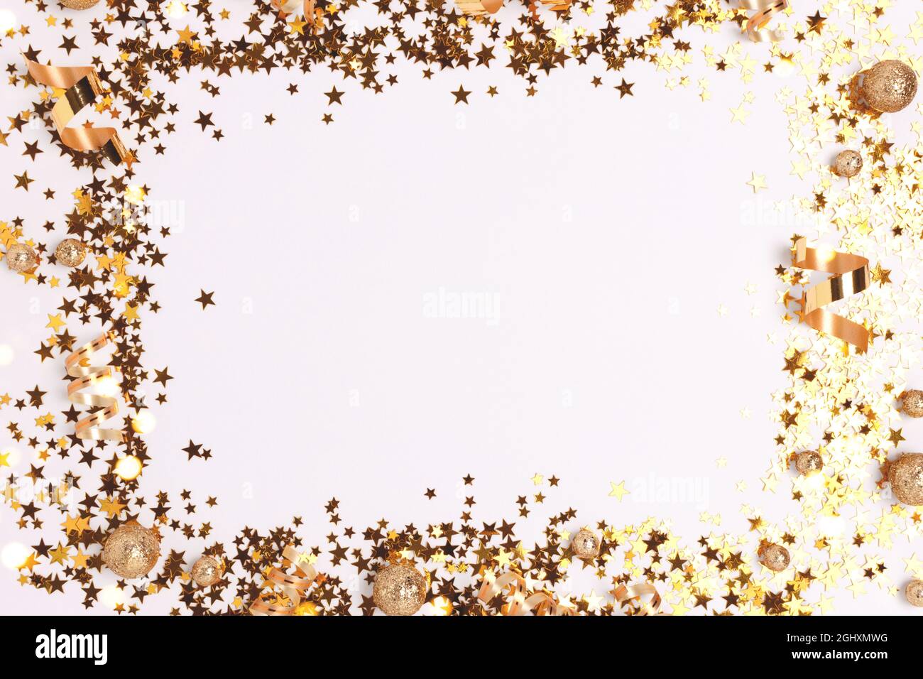 Border frame made of gold colored confetti on a white background Stock ...