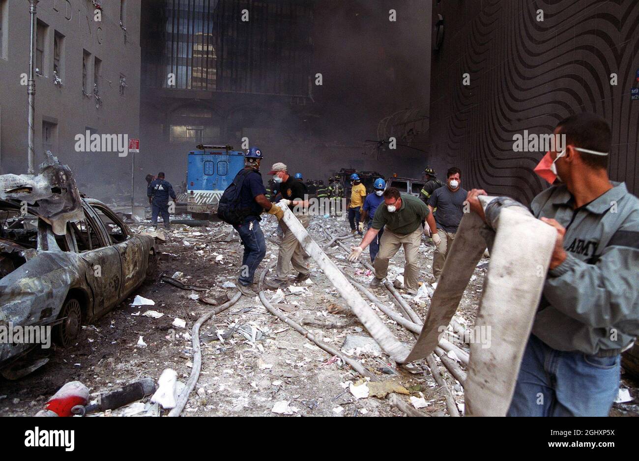 New York, USA. 11th Sep, 2001. Rescue crews work next to the WTC after ...