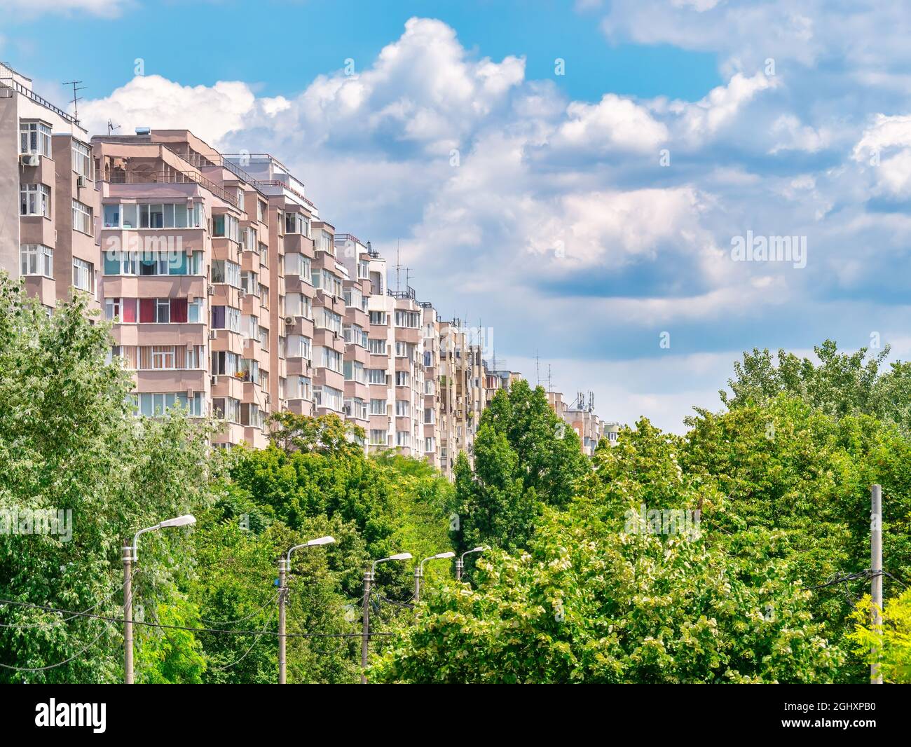Apartment building from the communist era against blue cloudy sky in ...