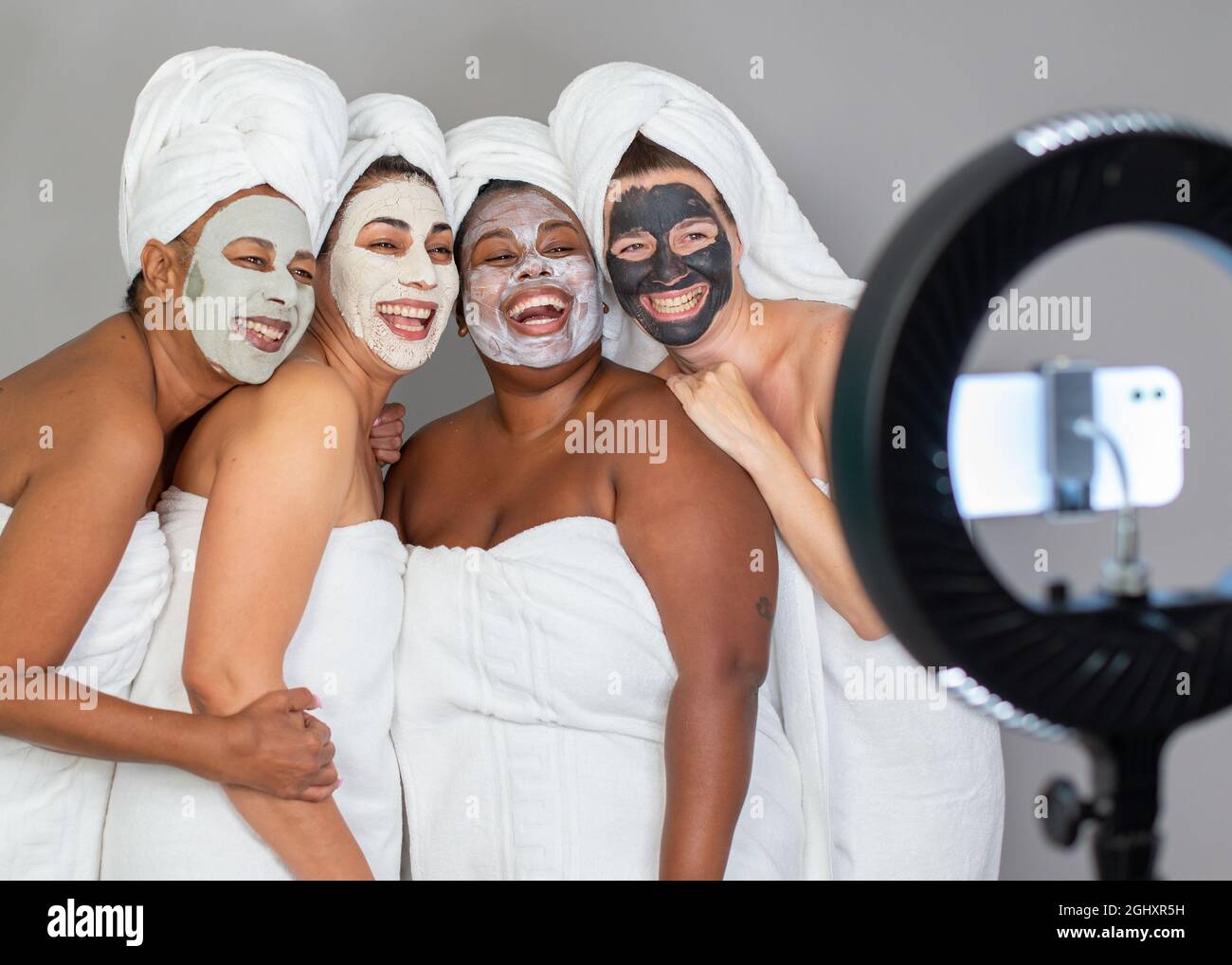 Diverse women taking selfie during spa session Stock Photo - Alamy