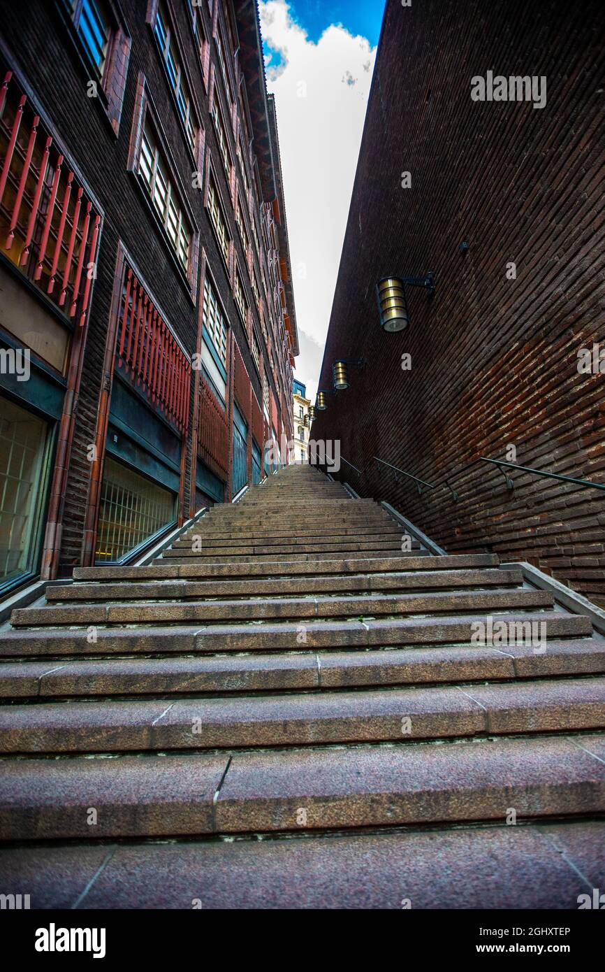 Low angle of urban narrow stairs between buildings Stock Photo - Alamy