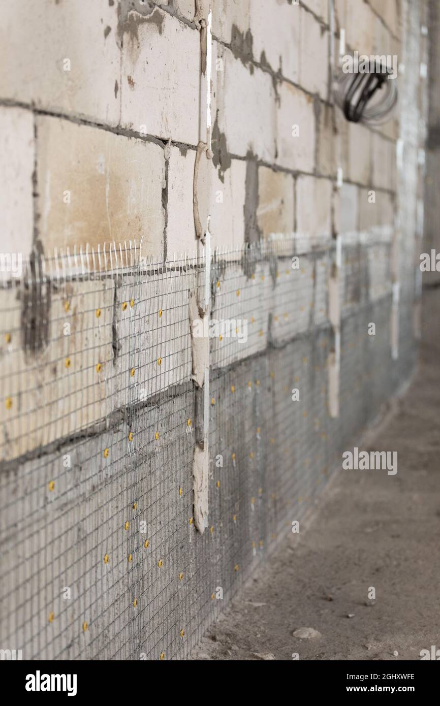 Concrete wall filled with wire mesh for further plastering Stock Photo ...