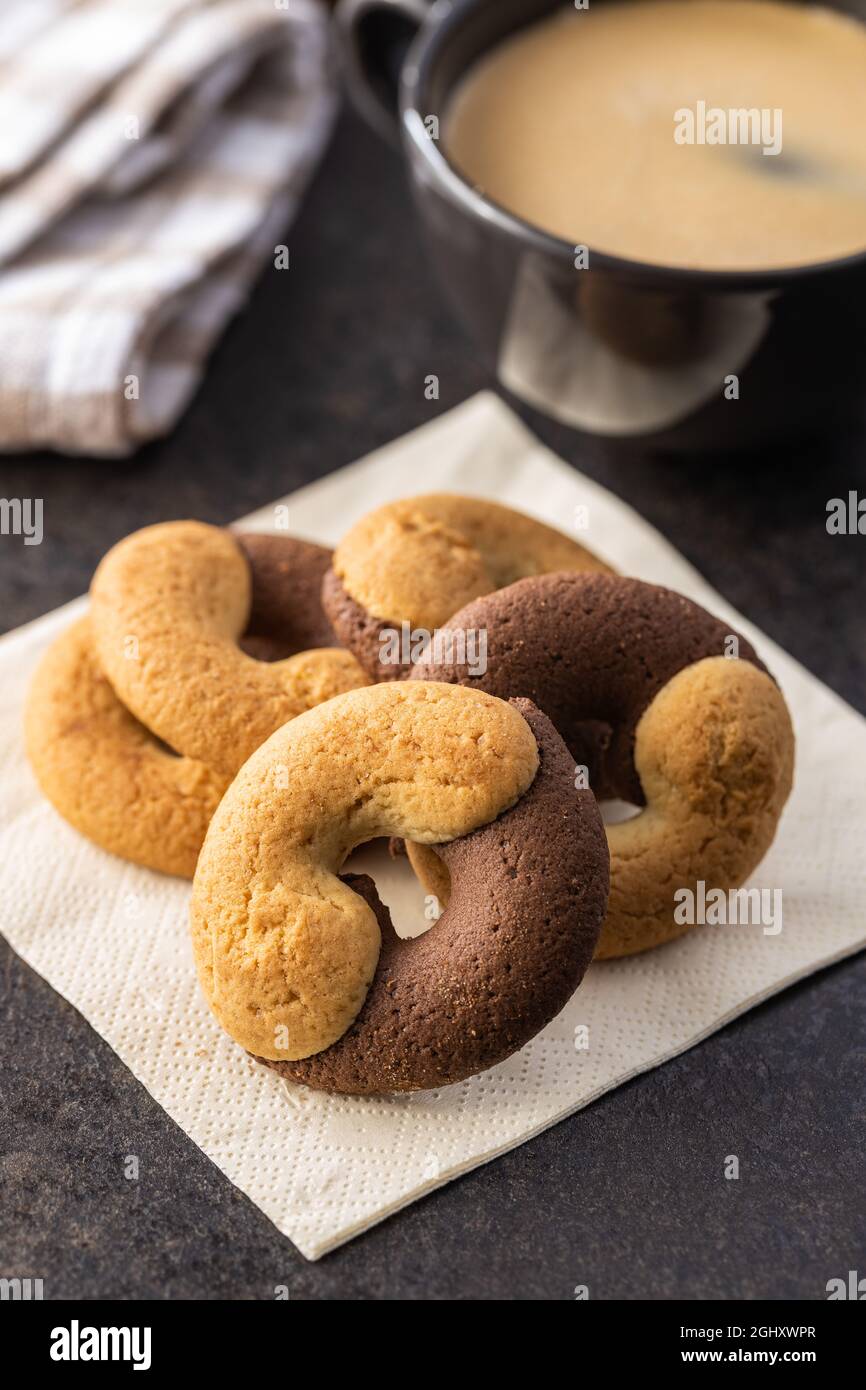 Sweet round biscuits. Cookies with double flavor on black table Stock ...