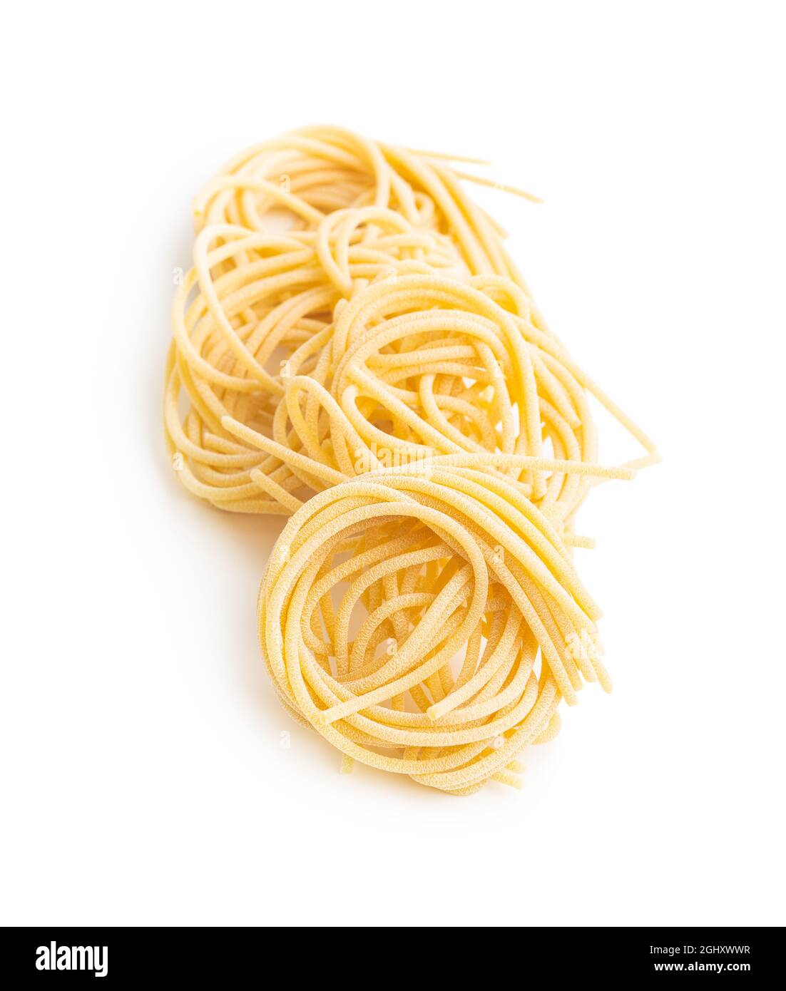 Italian pasta nest. Uncooked spaghetti nest isolated on white ...