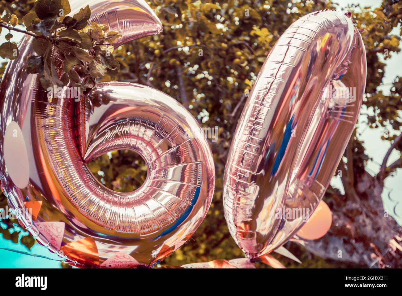 60th birthday balloons for the outdoors party Stock Photo - Alamy