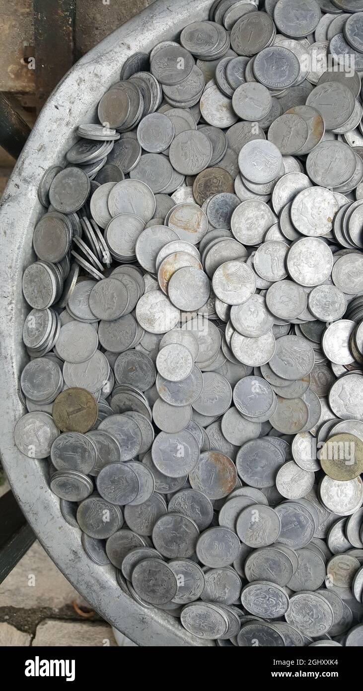 Vertical top view of a pile of old silver coins Stock Photo - Alamy